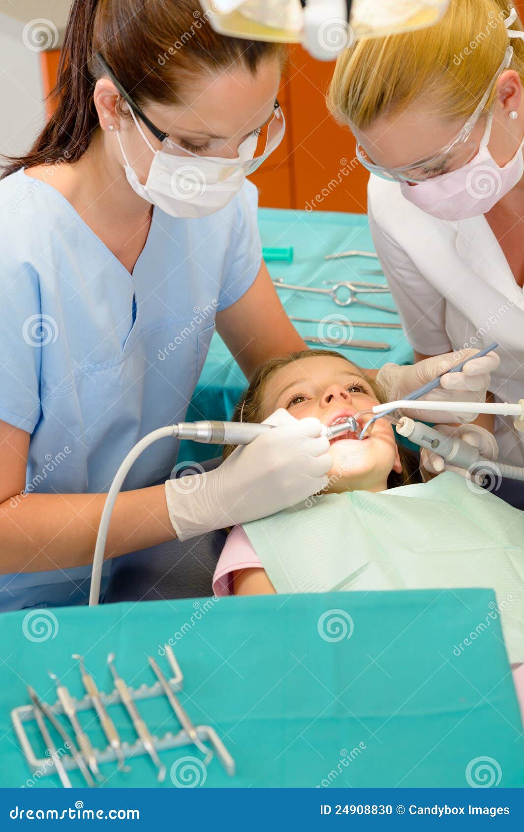 Dentist and Nurse Curing Little Girl Stock Photo - Image of child ...