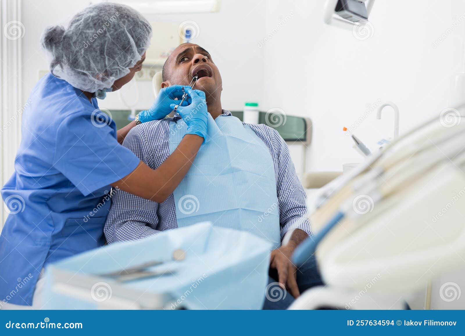 Dentist Operates on Patient - Removes Bad Tooth Stock Photo - Image of ...