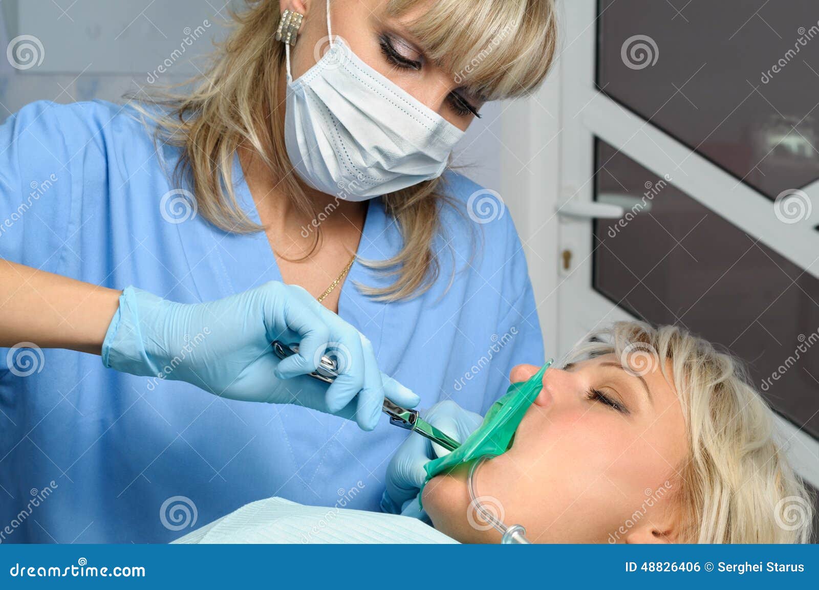 Installation Of A Rubber Dam With A Metal Clamp For Dental Fillings ...