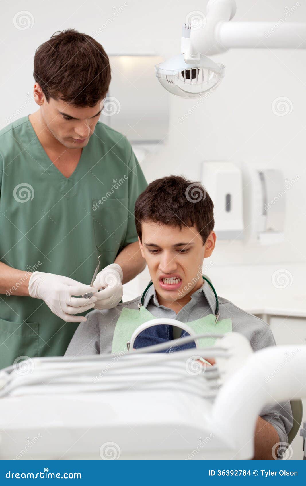 Dentist with Patient Looking at Teeth Stock Photo - Image of hygienist ...