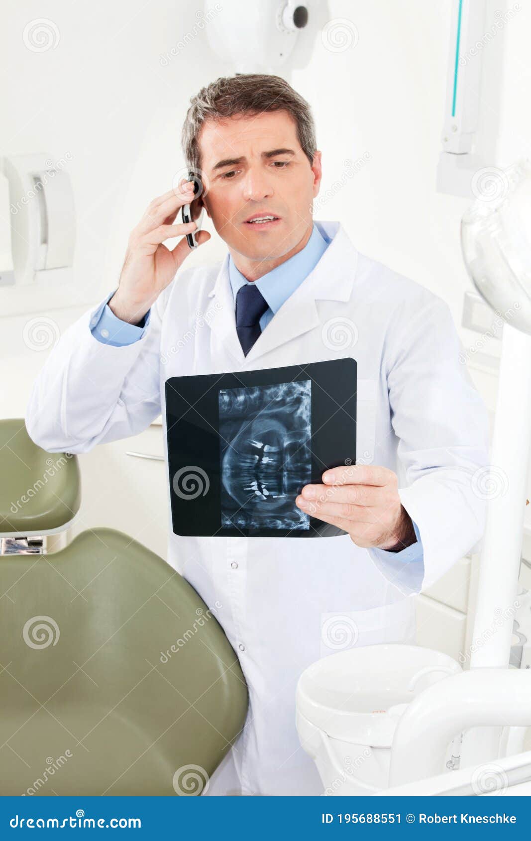 Dentist on the Phone with X-ray Image in Hand Stock Image - Image of ...