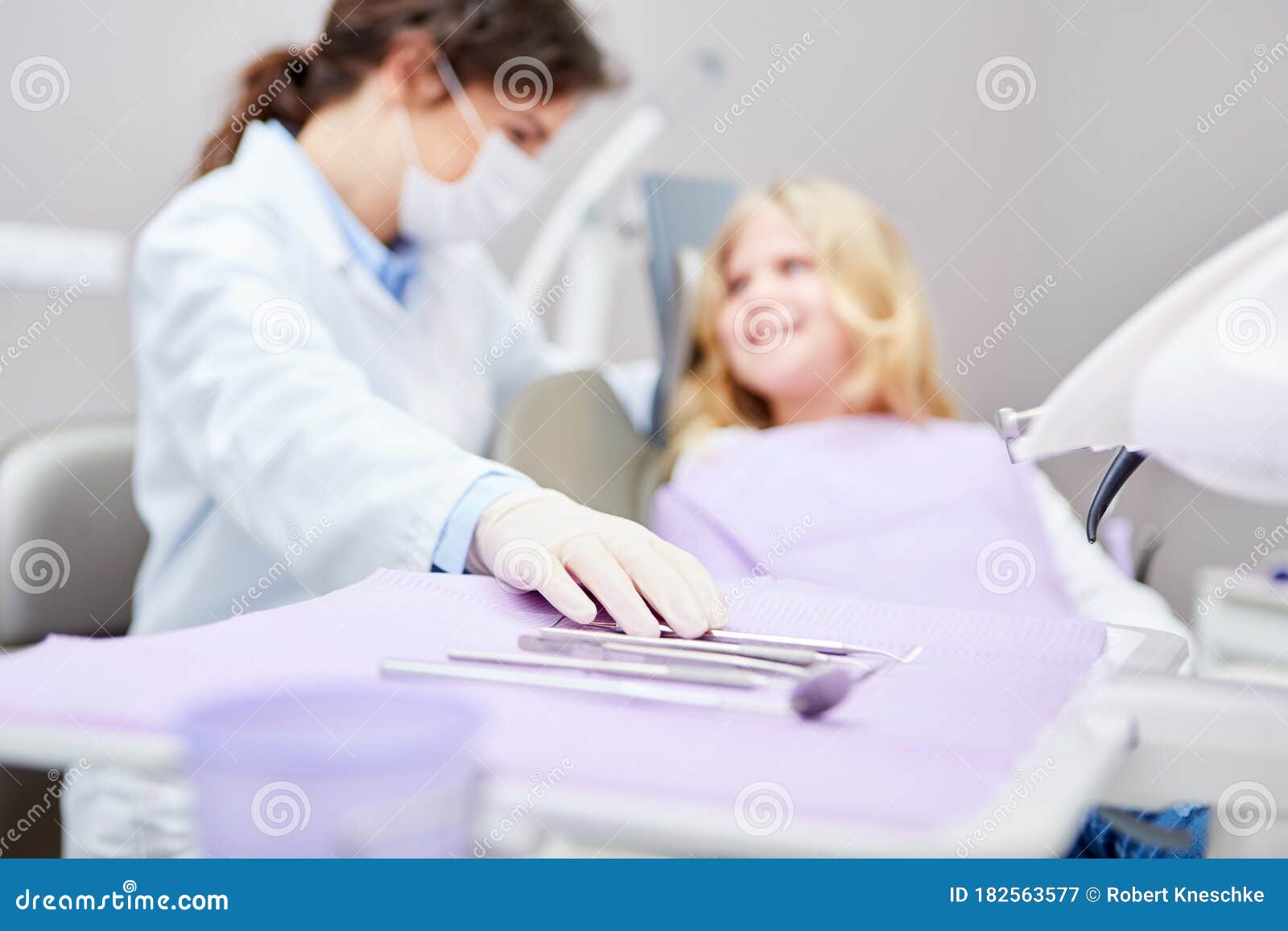 Dentist Picks Out Instruments for Examination Stock Image - Image of ...