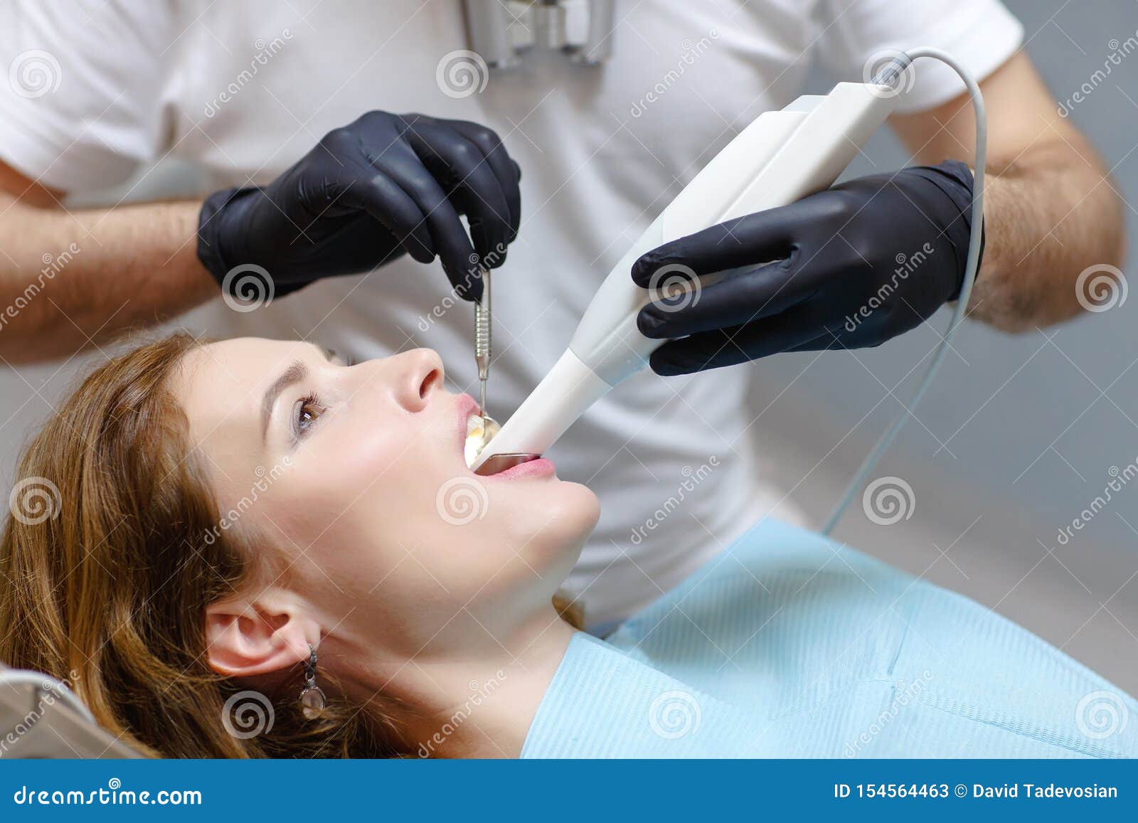 The Dentist Scans the Patient`s Teeth with a 3d Scanner Stock Image ...