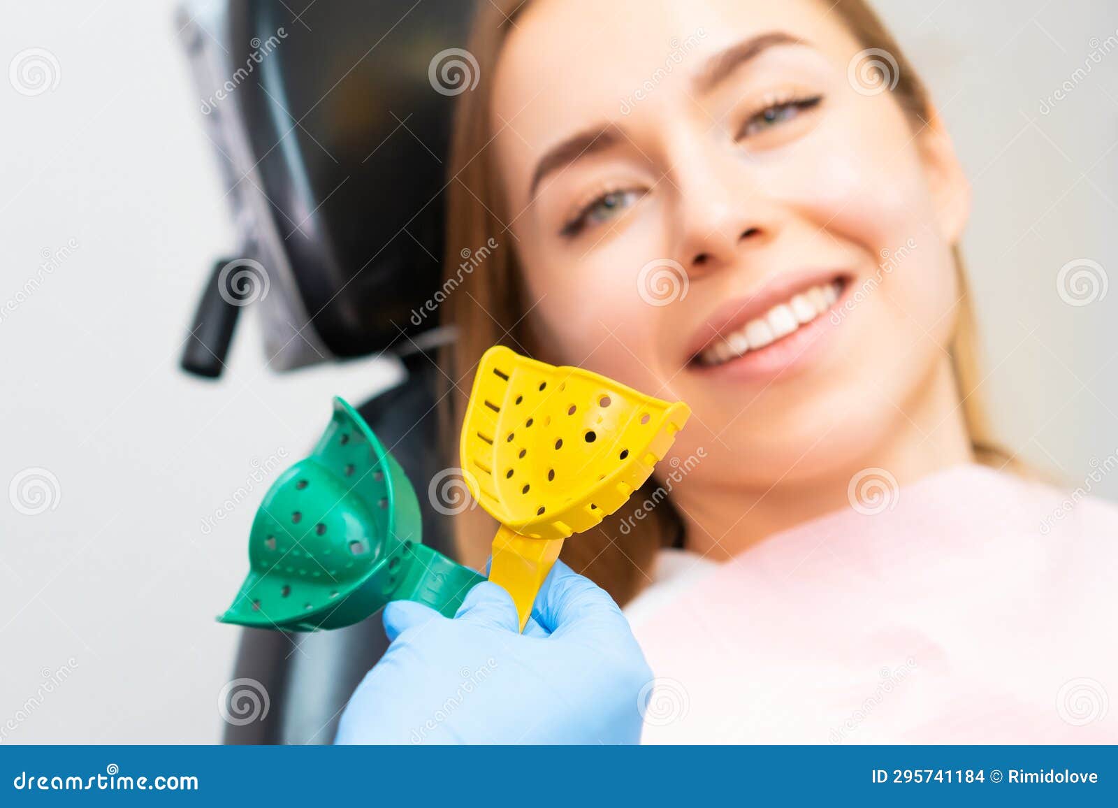 Dentist Selecting Plastic Forms or Spoon for Dental Impressions for ...