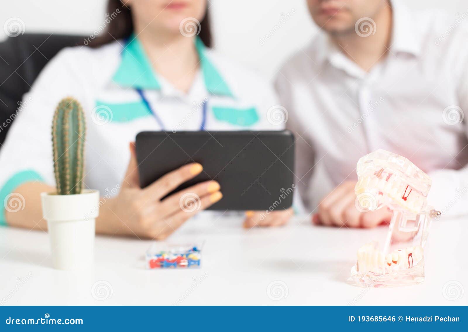 The Dentist Selects Dental Implants Using 3D Dental Implantation. a ...