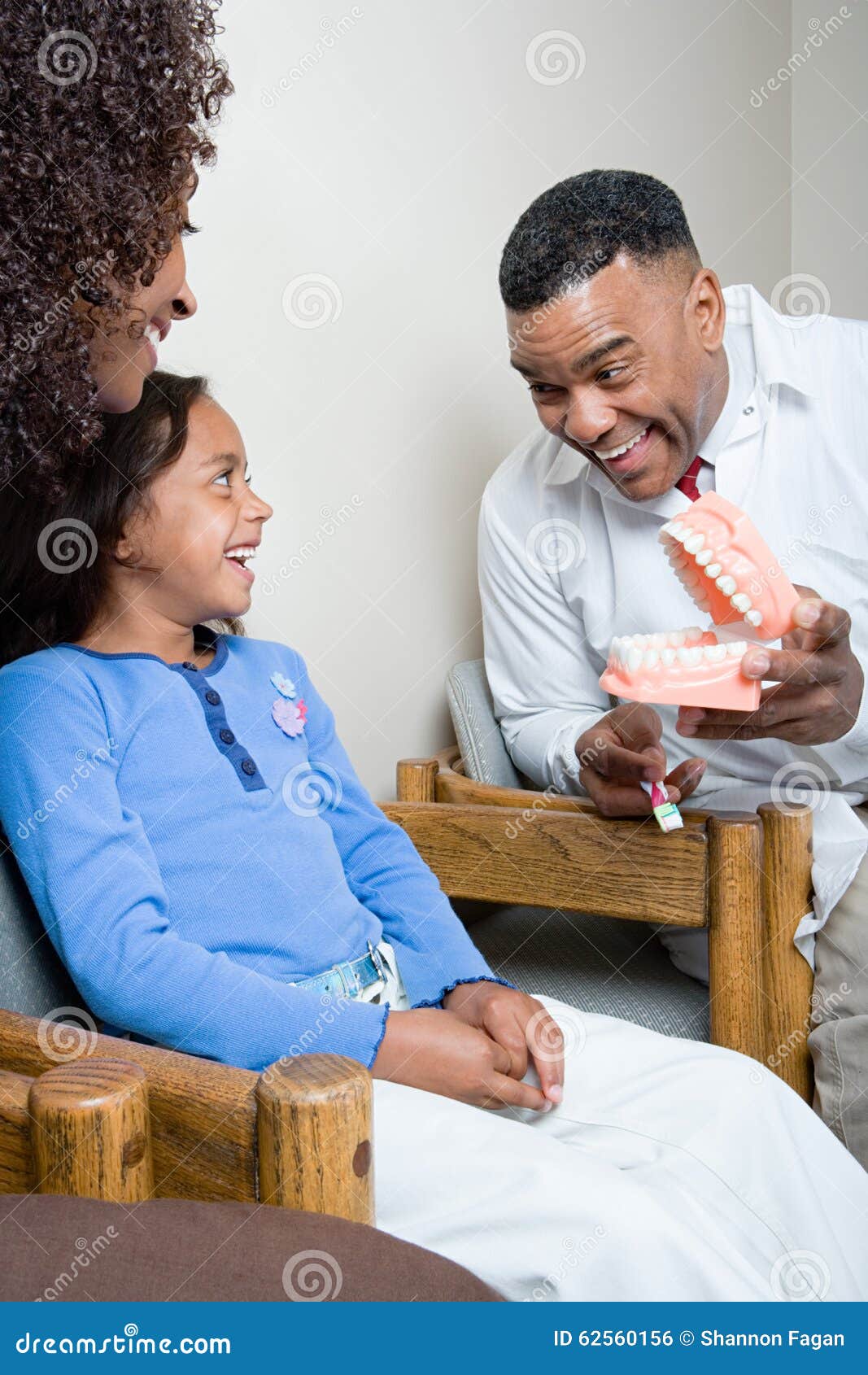 Dentist Showing Patient How To Clean Teeth Stock Photo - Image of ...