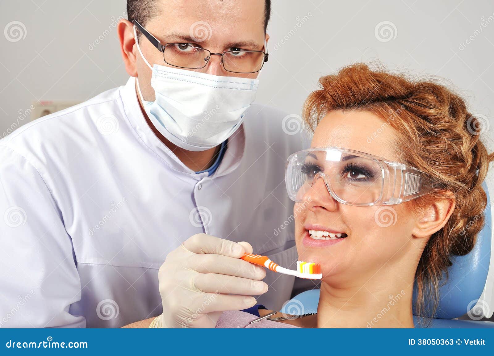 Dentist shows toothbrush stock image. Image of ophthalmologist - 38050363