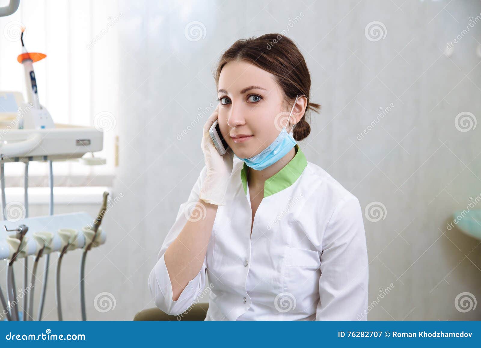 Dentist Talking on the Phone in Dental Office. Concept of Healthy Stock ...