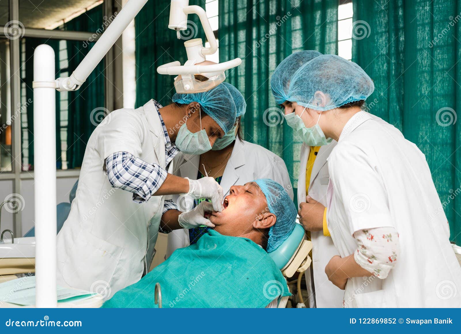 Dentist with Team Members at Work Editorial Photography - Image of ...