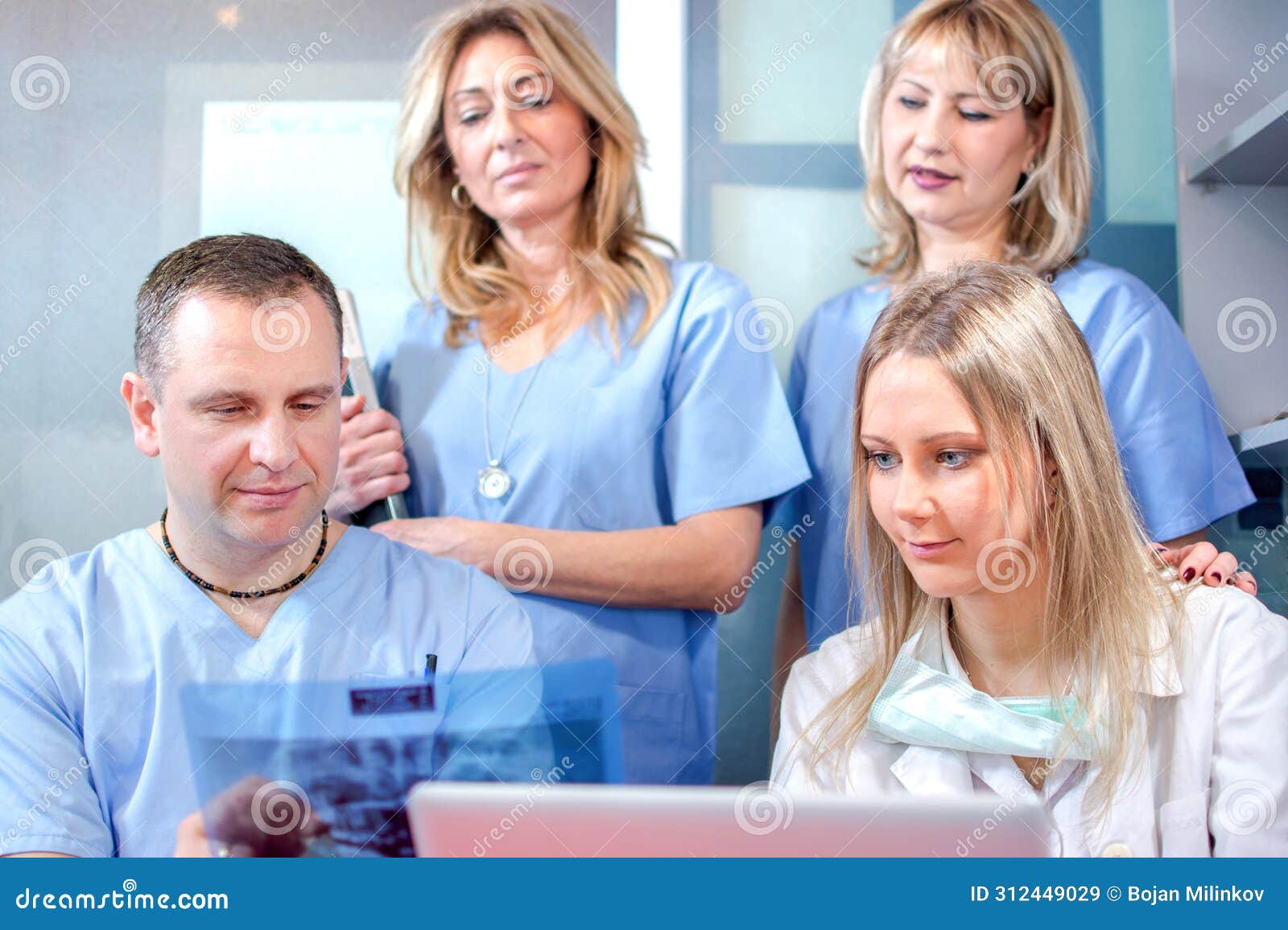 Dentist Team Working Together in Dental Office. Stock Image - Image of ...