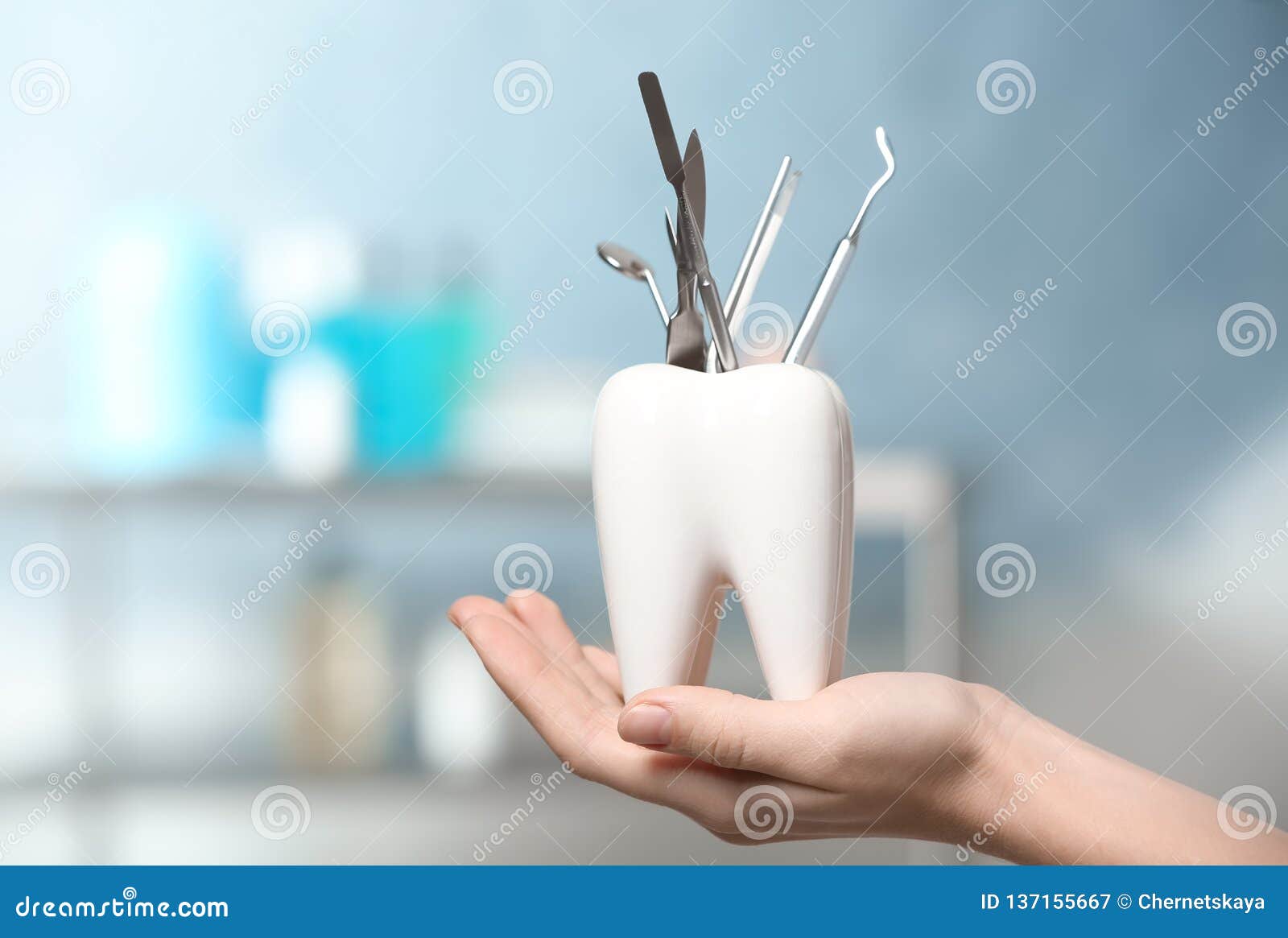 Dentist with Tooth Shaped Holder Full of Professional Tools in Clinic ...