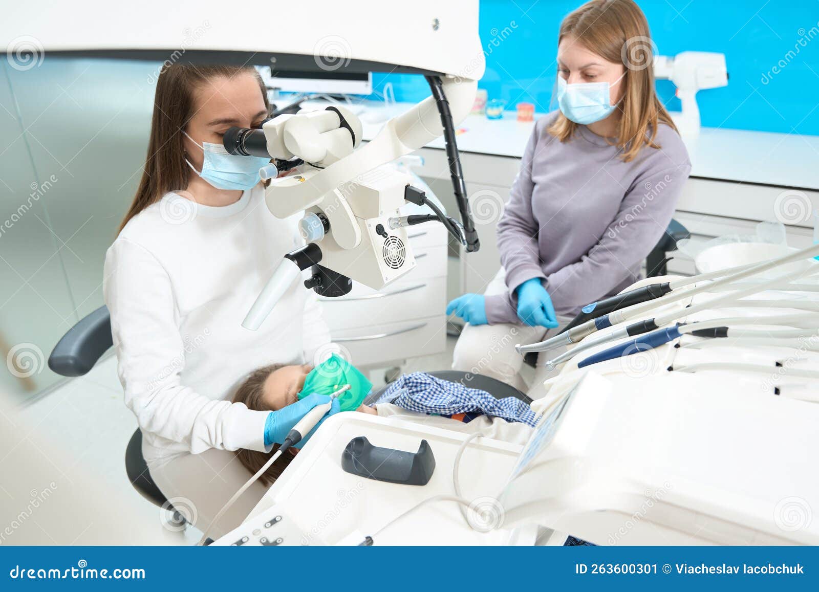 Dentist is Treating Boy Tooth Under Microscope, she Uses Modern ...