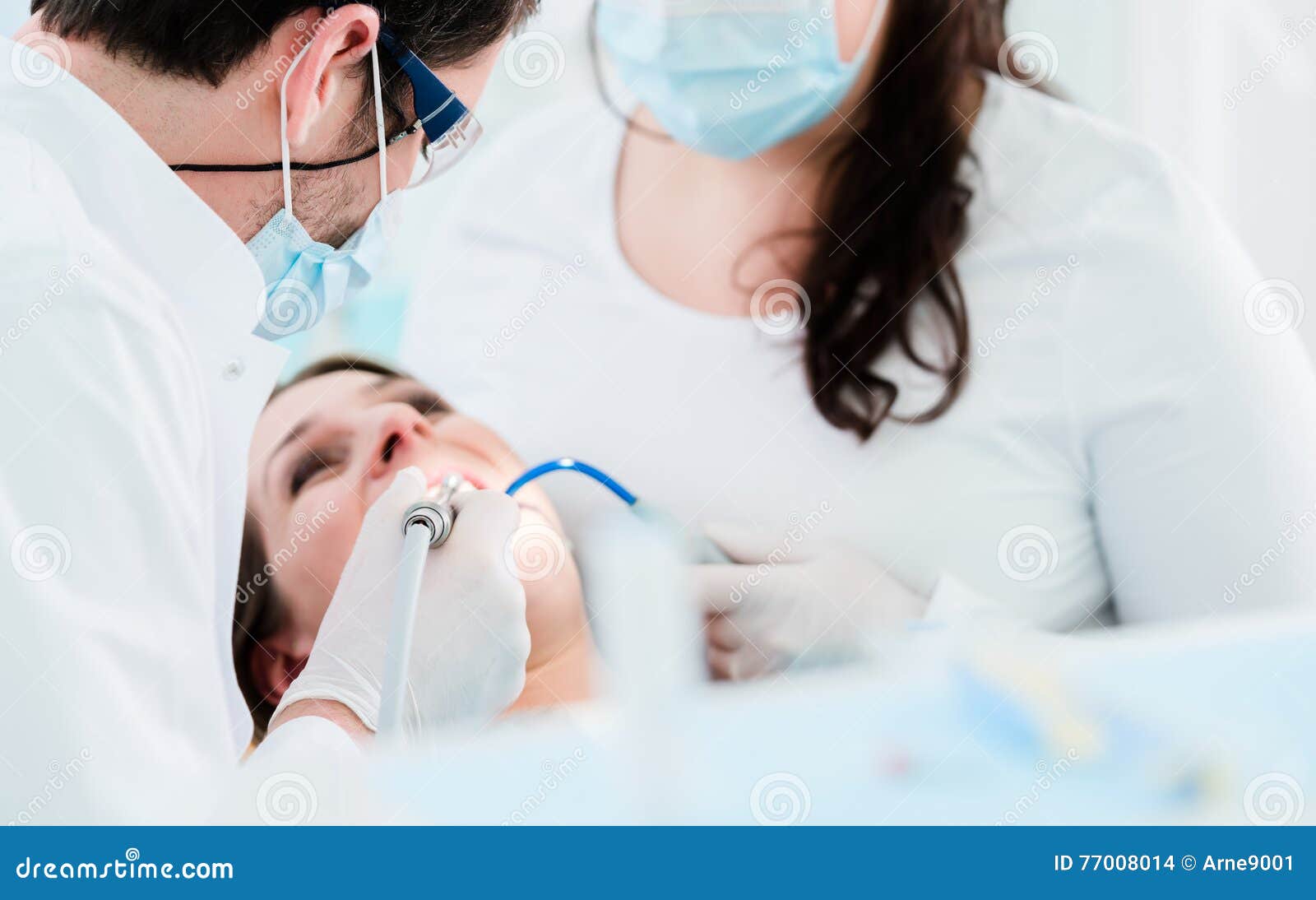 Dentist Treating Woman Patient with Drill Stock Photo - Image of doctor ...