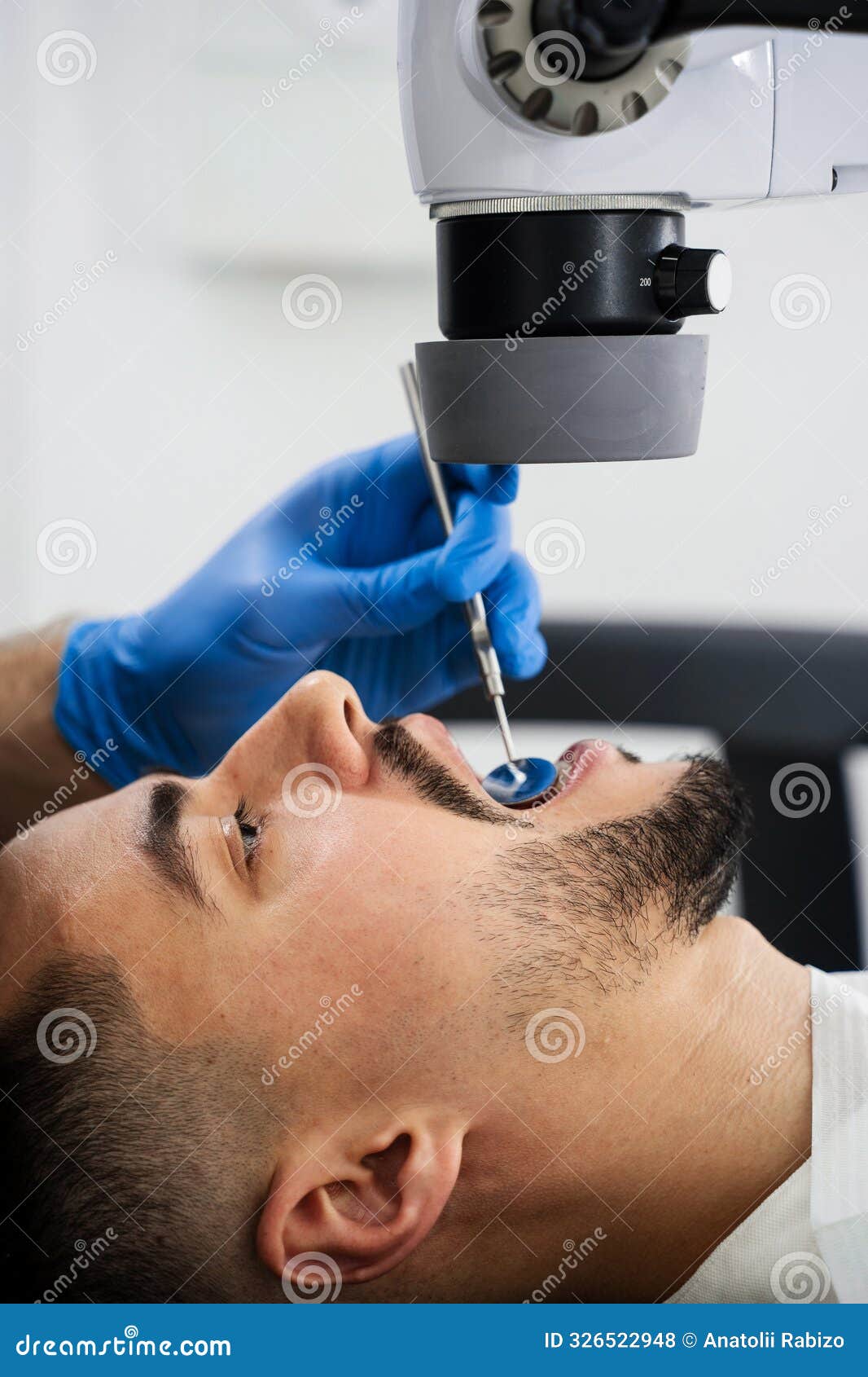 Dentist Uses Operating Microscope To Polish Teeth of the Patient ...