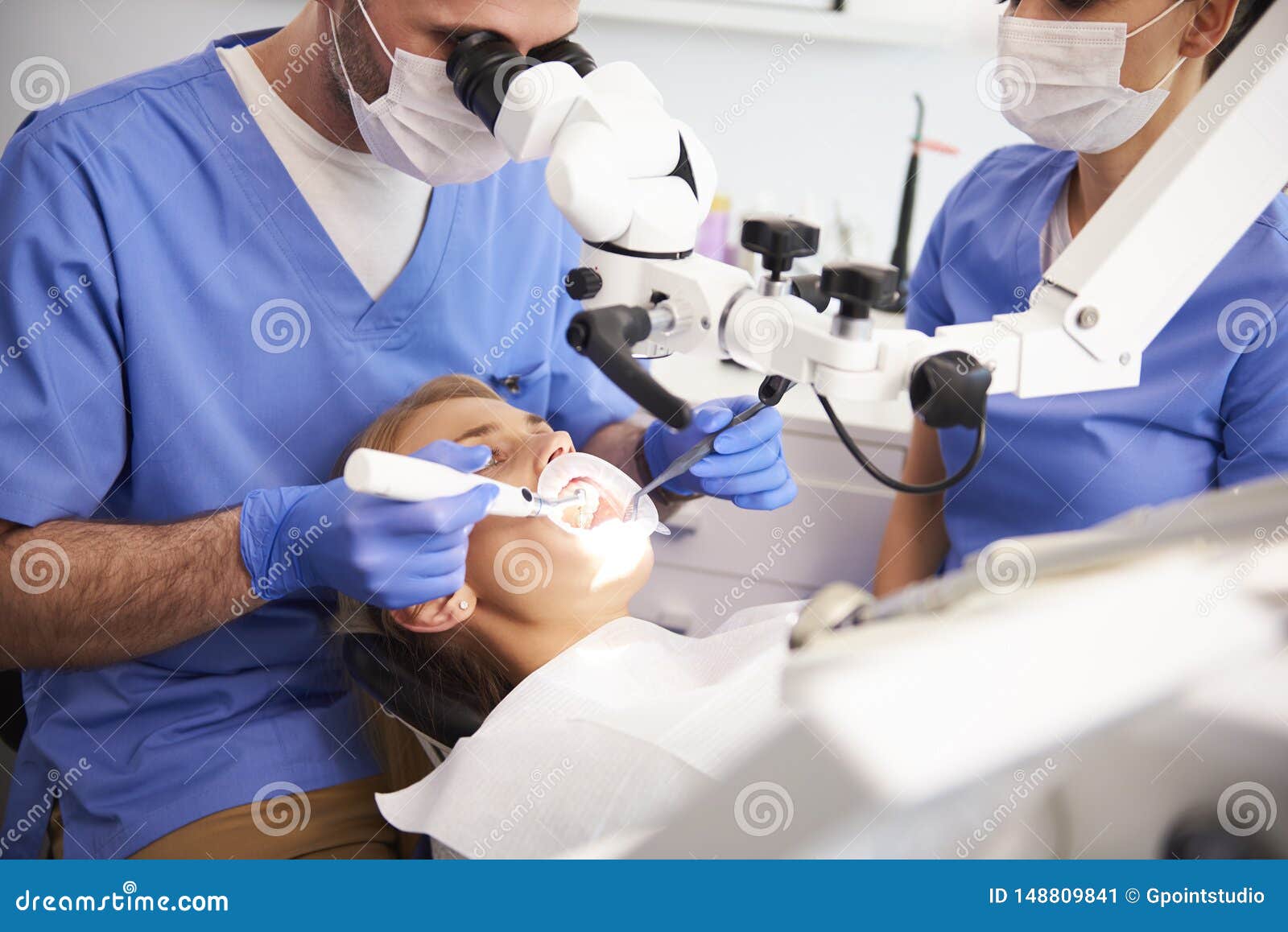 Dentist Using Dental Microscope and Examining Woman`s Teeth Stock Image ...
