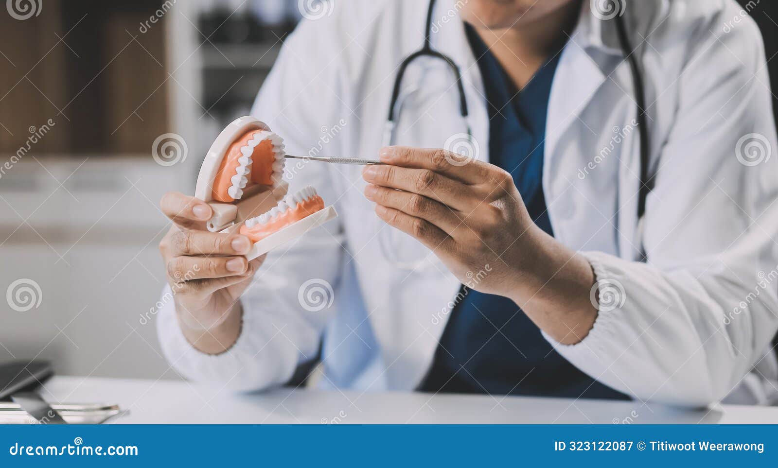 A Dentist is Using Specialized Dental Equipment To Inspect Dentures To ...