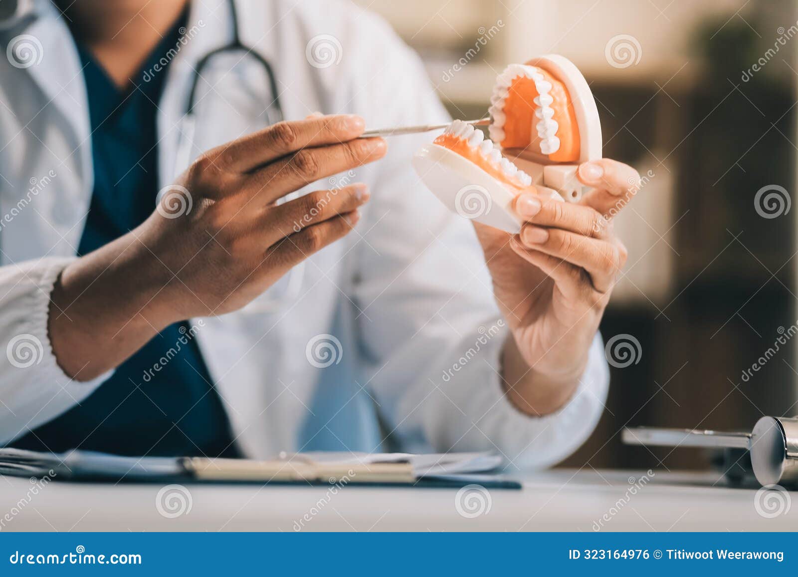 A Dentist is Using Specialized Dental Equipment To Inspect Dentures To ...