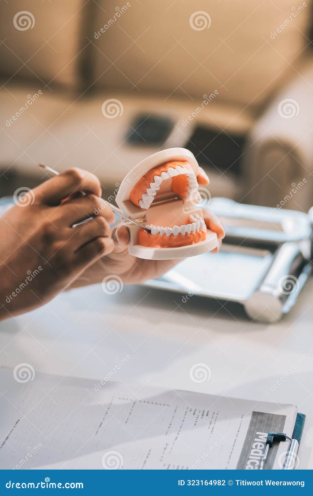 A Dentist is Using Specialized Dental Equipment To Inspect Dentures To ...