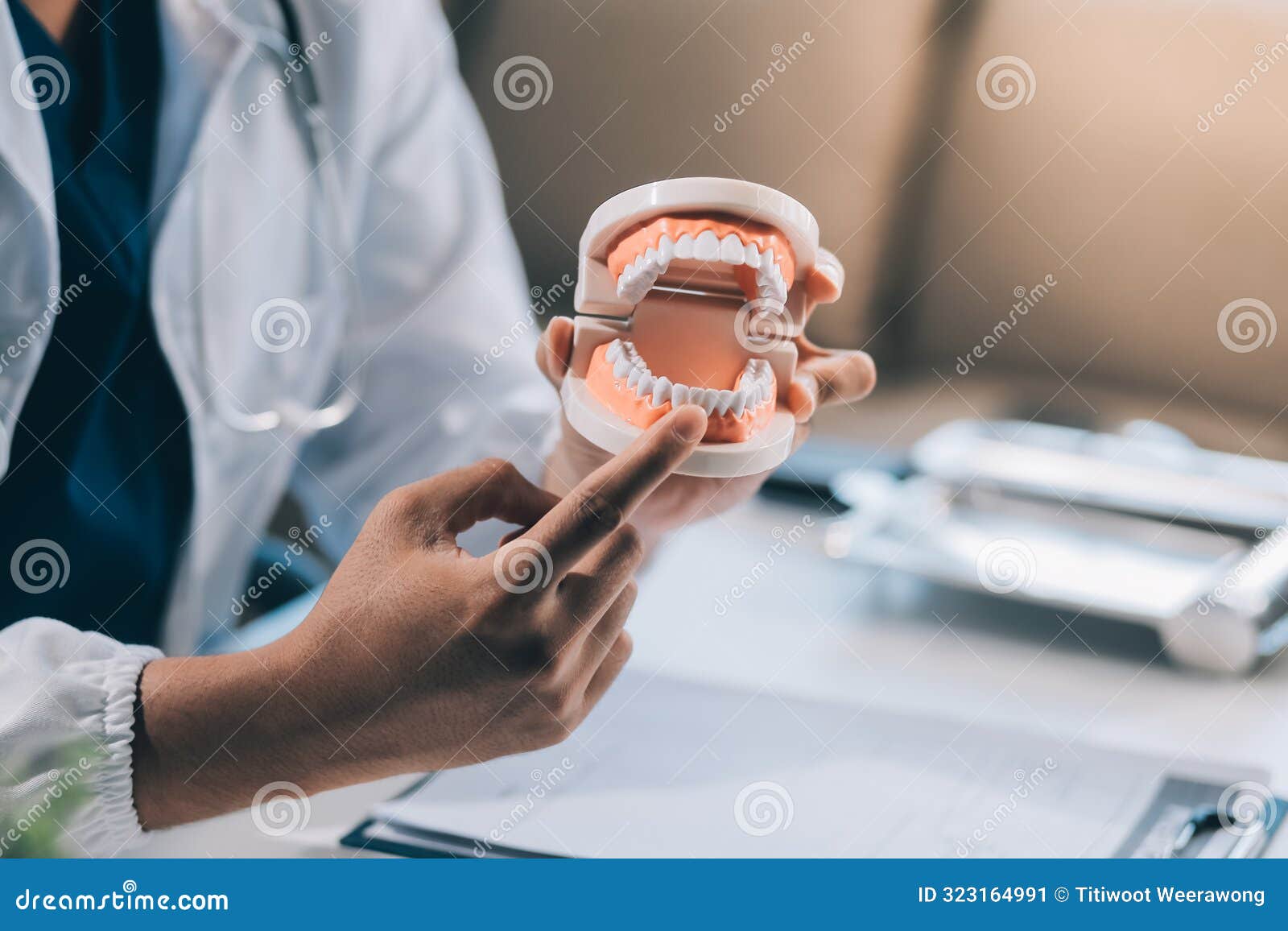 A Dentist is Using Specialized Dental Equipment To Inspect Dentures To ...