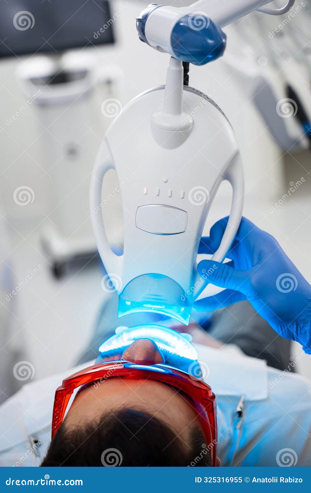 Dentist is Whitening Teeth of His Patient with Ultraviolet Stomatology ...