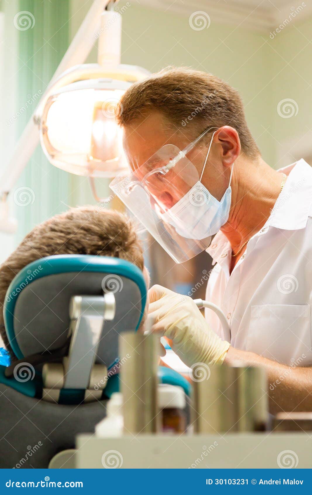 Dentist at work stock image. Image of dentist, chair - 30103231