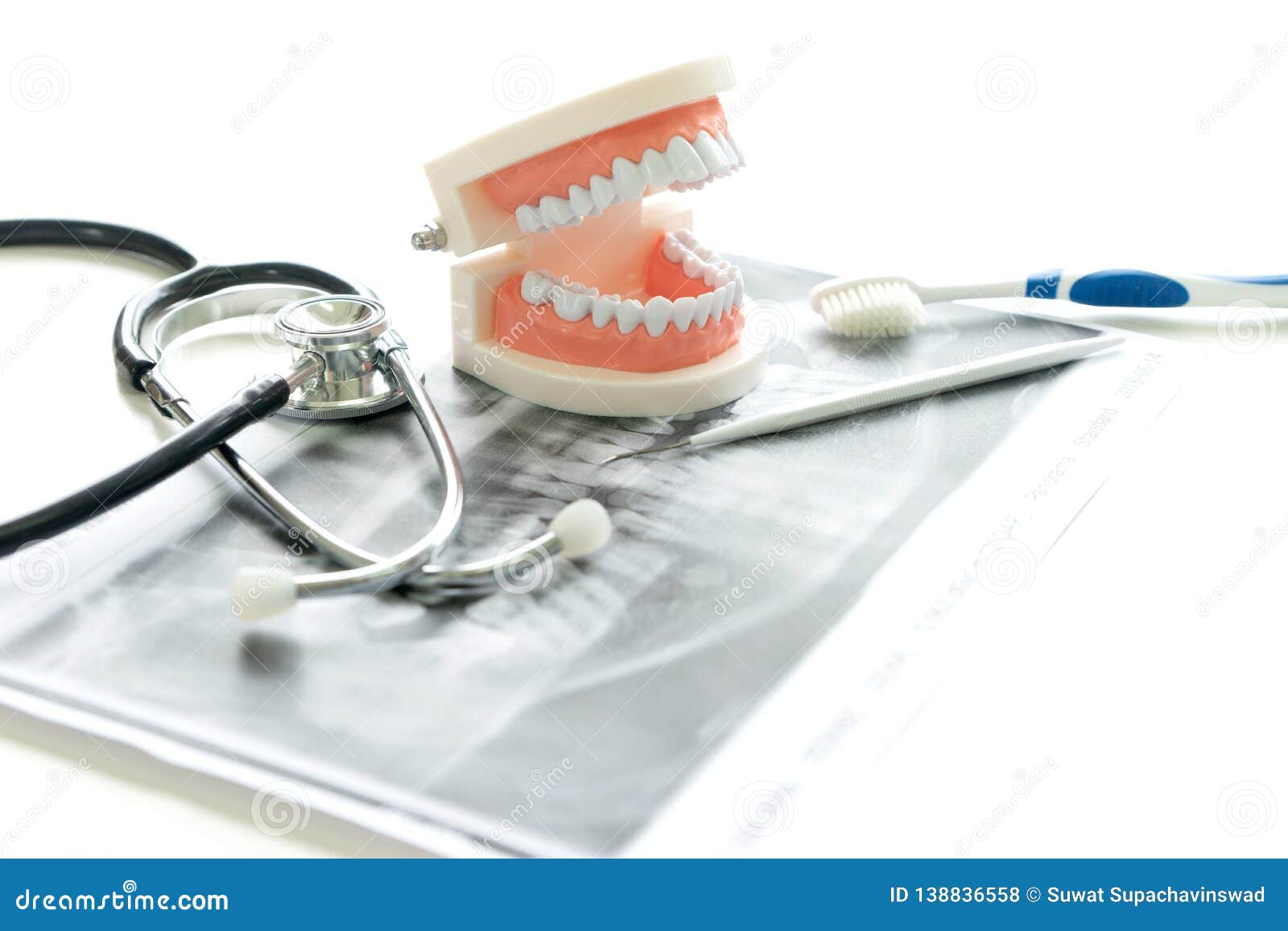 Dentist Work on the Table with Denture and Teeth X-ray Stock Photo ...