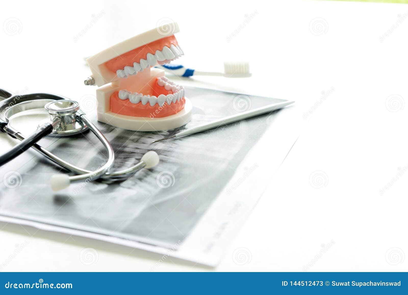 Dentist Work on the Table with Denture and Teeth X-ray Stock Image ...