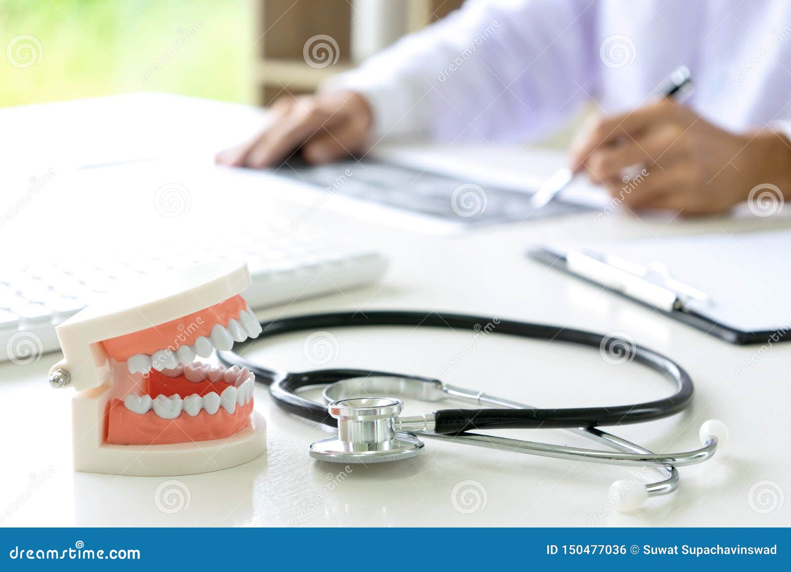 Dentist Work on the Table with Denture and Teeth X-ray Stock Photo ...