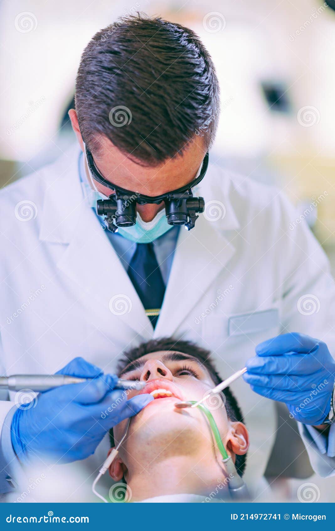 Dentist Working with Young Man Stock Image - Image of cosmetic, oral ...