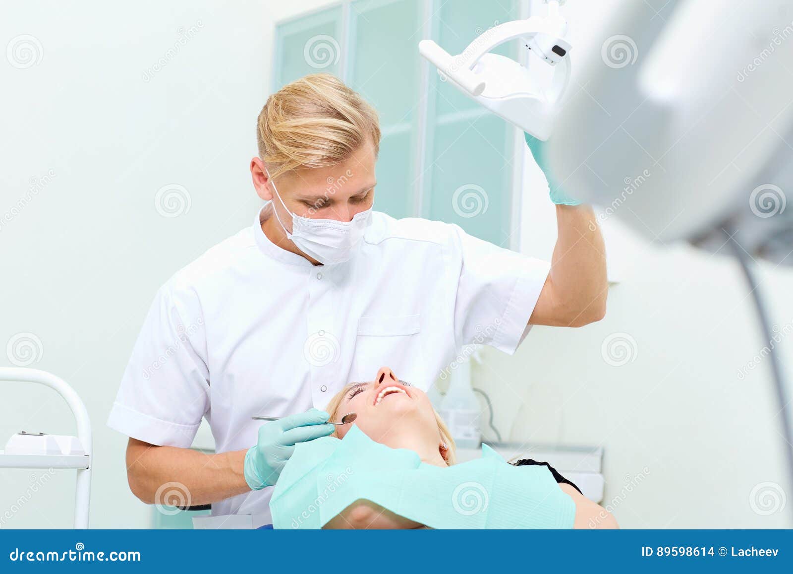 Dentist on a Workplace with the Patient in a Stomatologic Clinic Stock ...