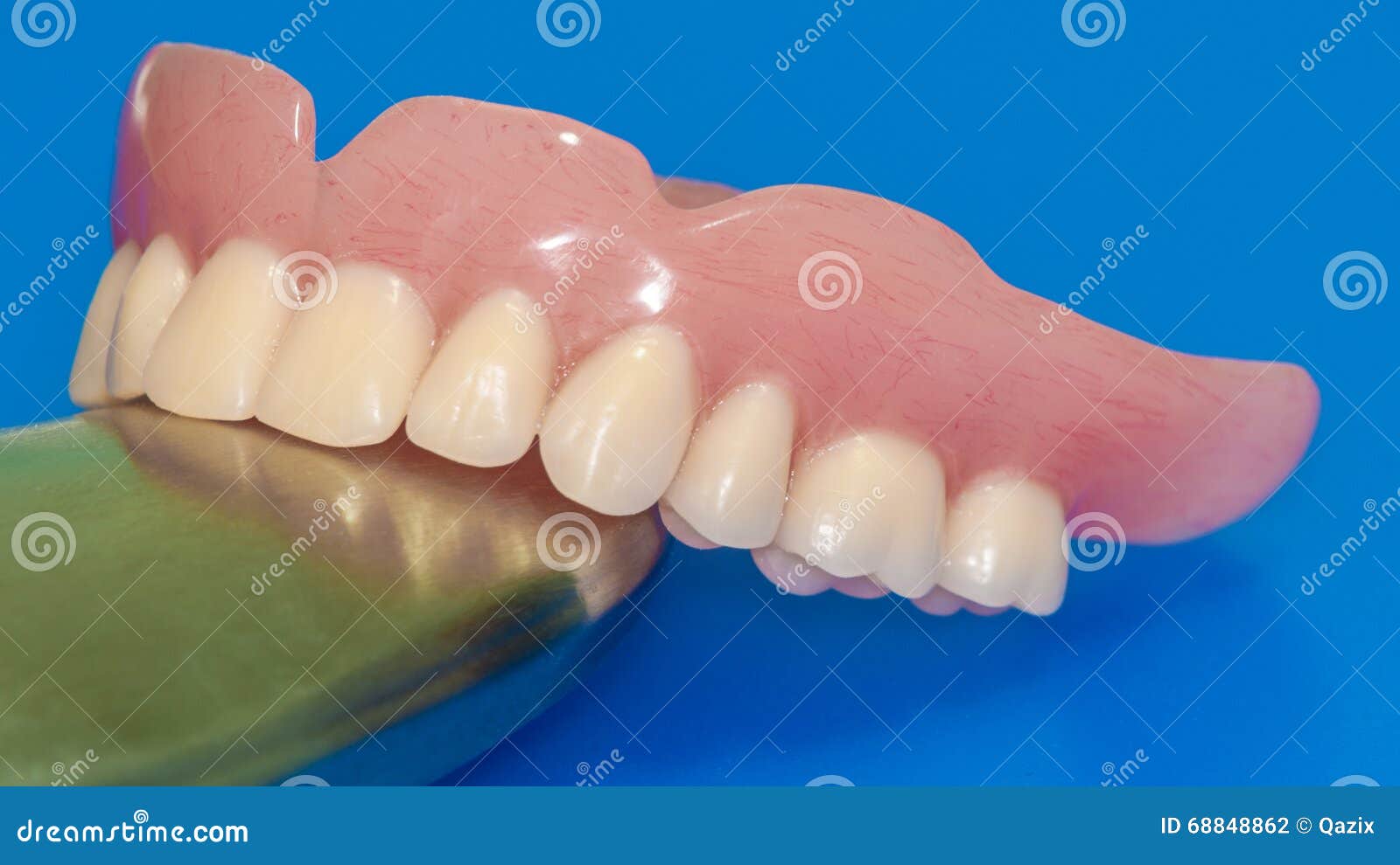 Denture on a Blue Background Stock Photo - Image of blue, object: 68848862
