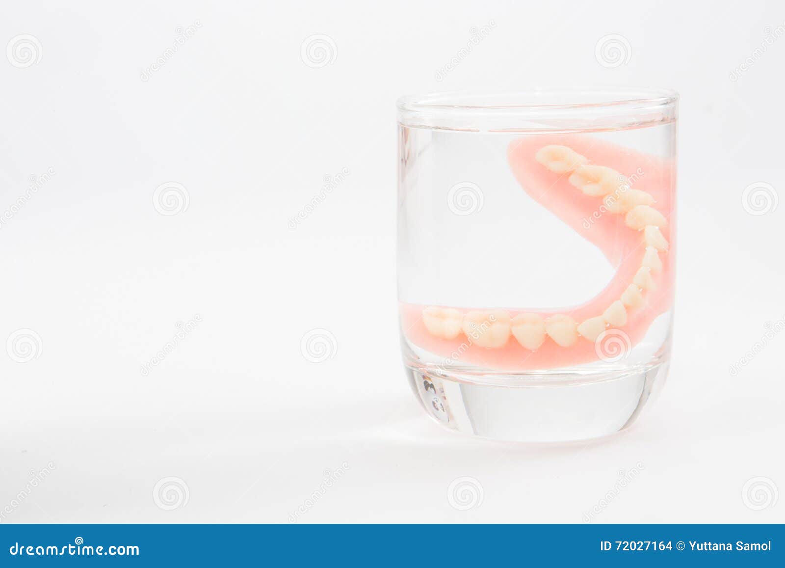 Denture is Cleaned in a Glass of Water. Proper Hygiene Stock Photo ...