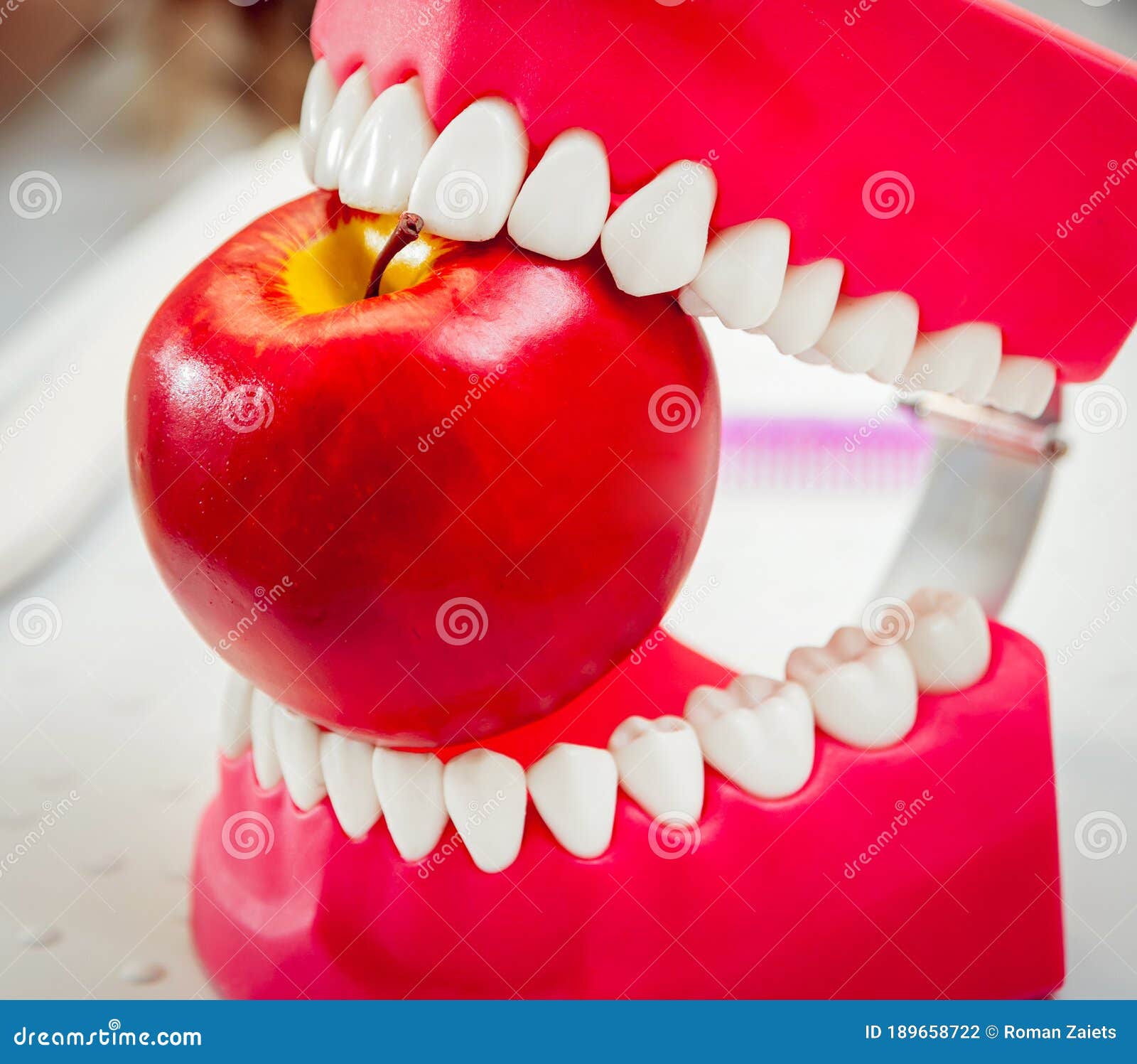 Dentures Biting an Apple. Funny Joke. Medical Background. Stock Photo ...