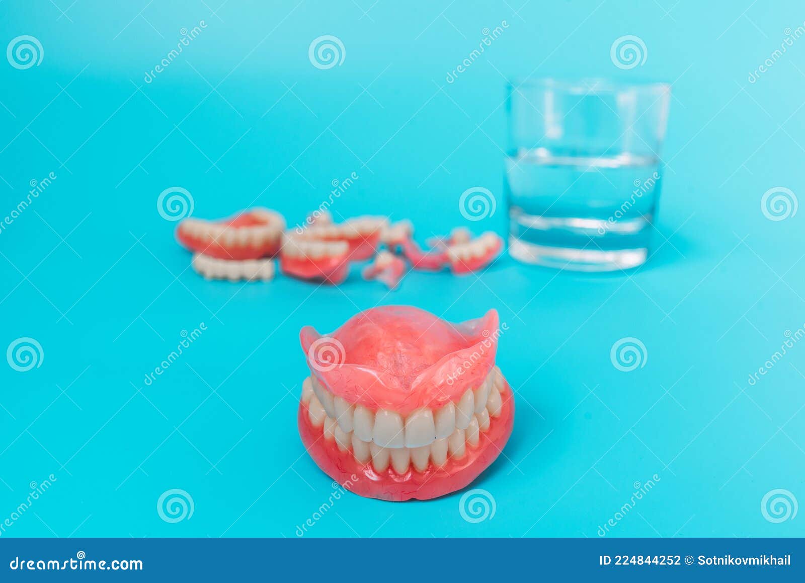 Dentures on a Blue Background. Close-up of Dentures. Full Removable ...