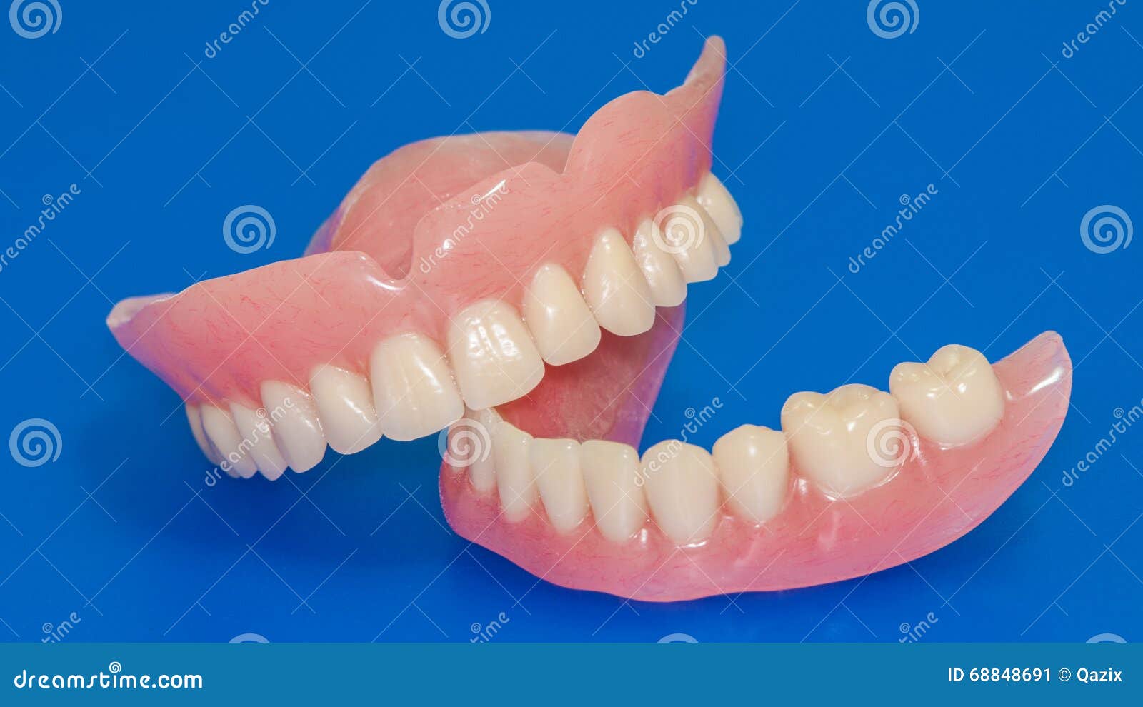 Dentures on a Blue Background Stock Image - Image of removable ...