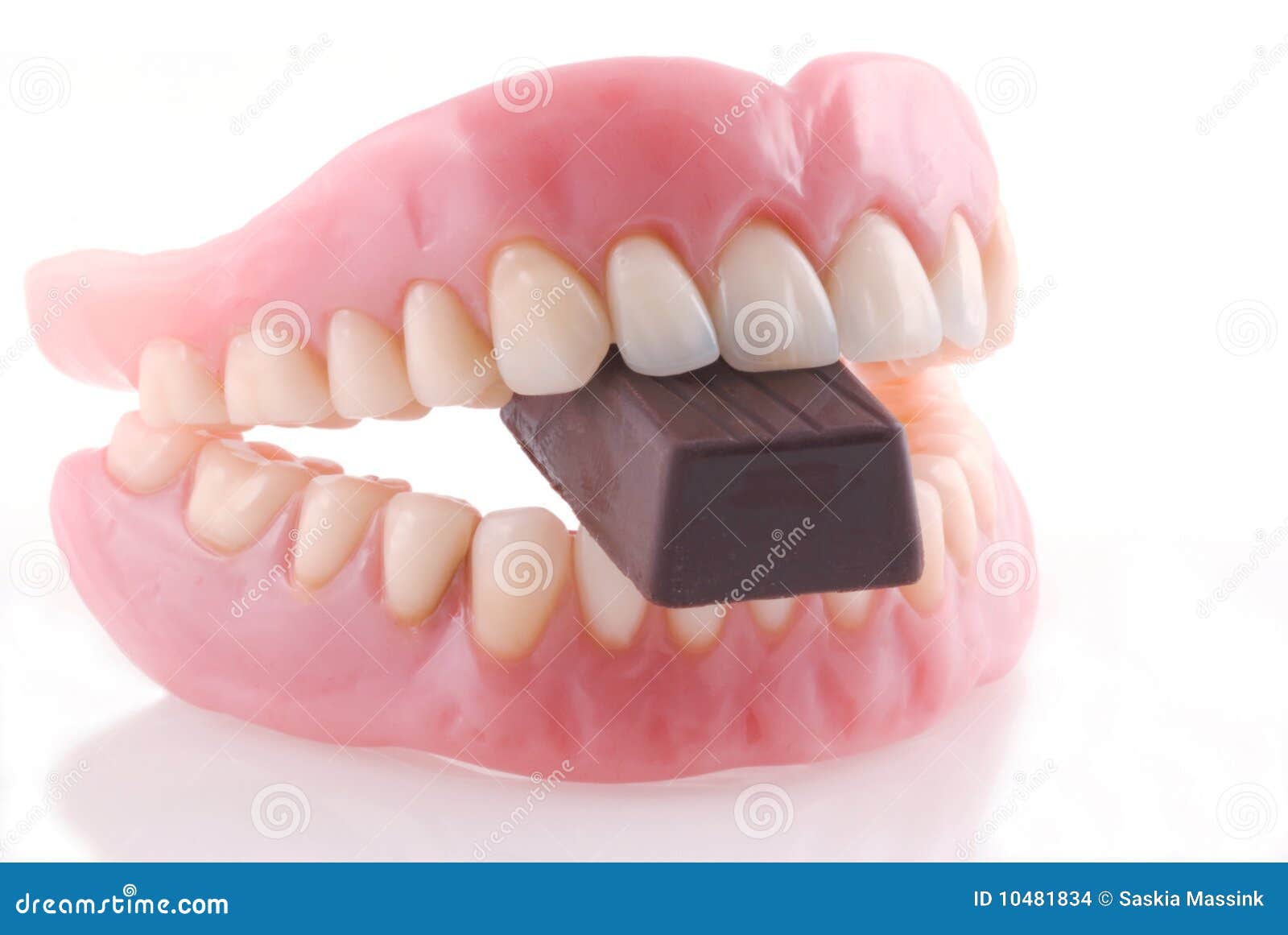 Dentures and chocolat. stock photo. Image of prosthesis - 10481834