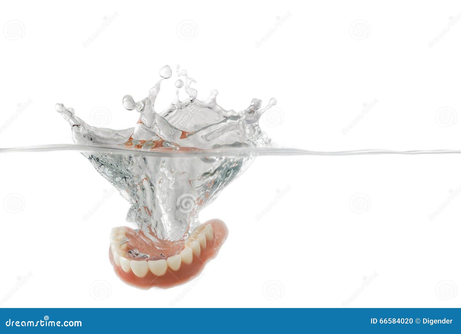 Dentures Splashing into Clear Water Stock Photo - Image of clear ...