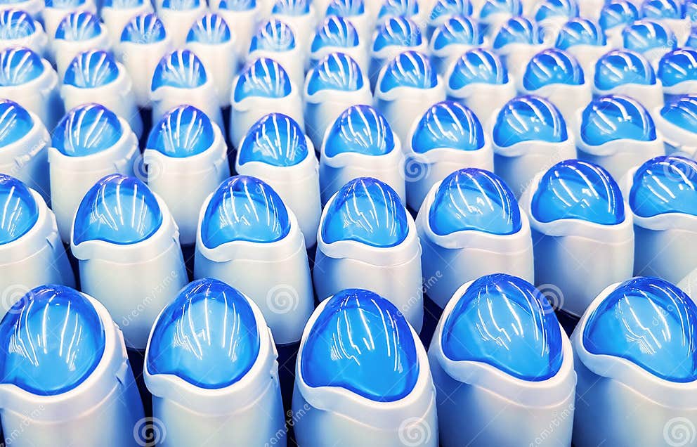 Deodorant, Bottles with Blue Lids in a Row. Stock Photo - Image of ...