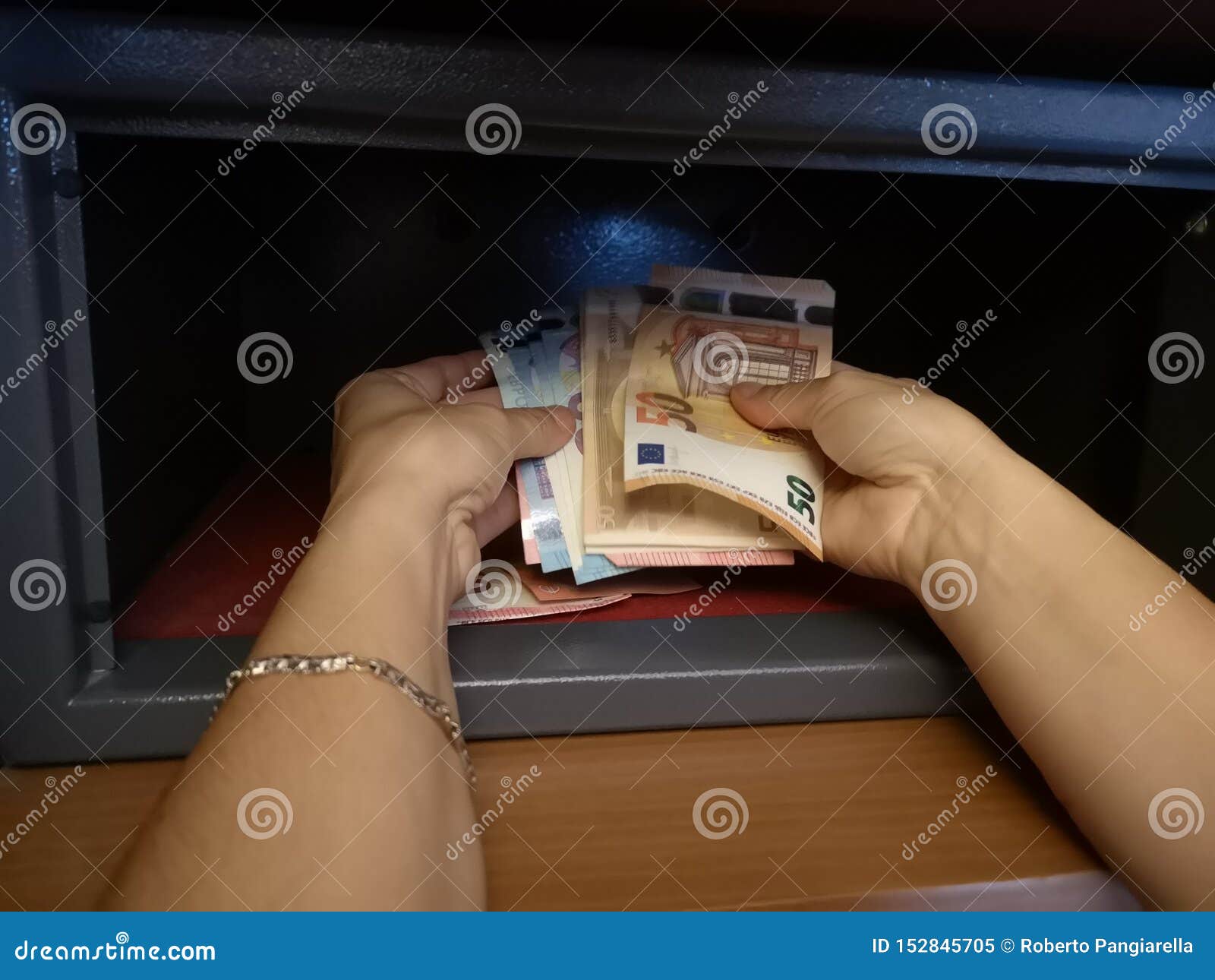 Deposit Banknotes in the Safe Stock Image - Image of banknotes, hand ...