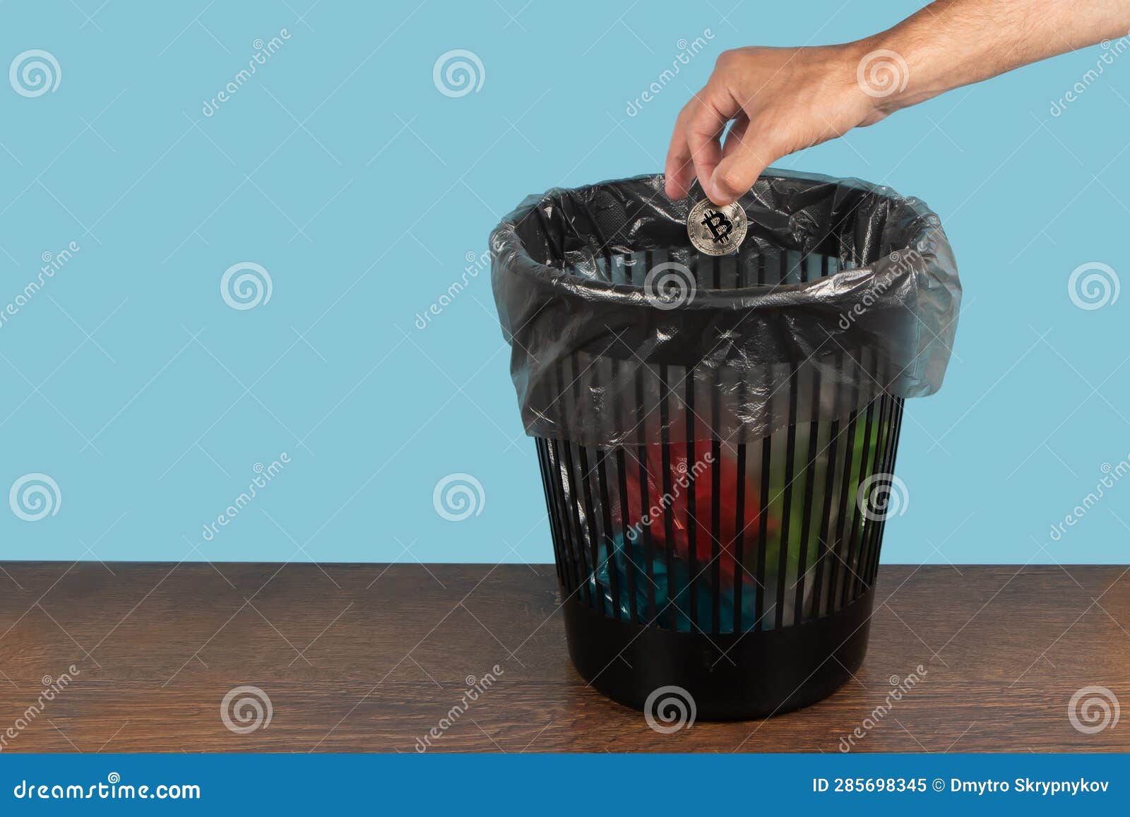 Depreciation Bitcoin. Hand Throws Bitcoin into Trash Bin with Package ...