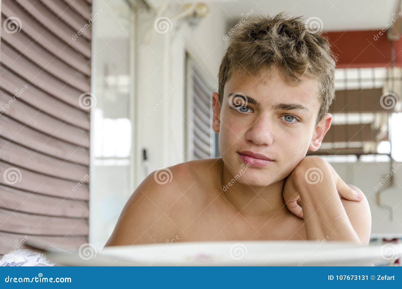 Depressed Boy Smiling Discrete on Camera Stock Image - Image of people ...
