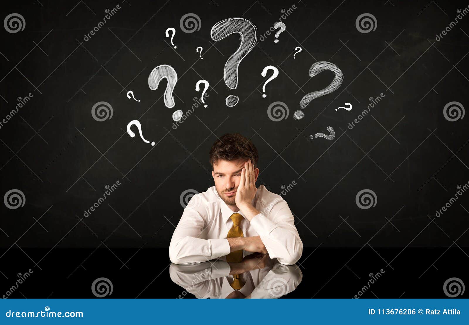 Sitting Businessman Under Question Marks Stock Photo - Image of male ...