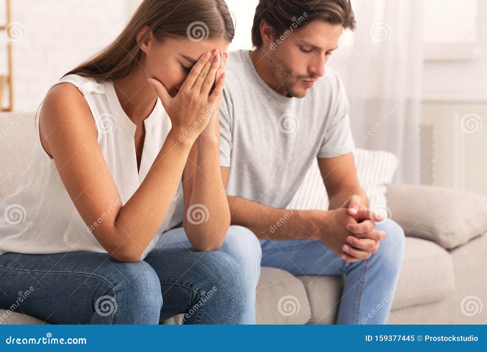 Depressed Couple Sitting Together after Break Up Conversation Indoor ...