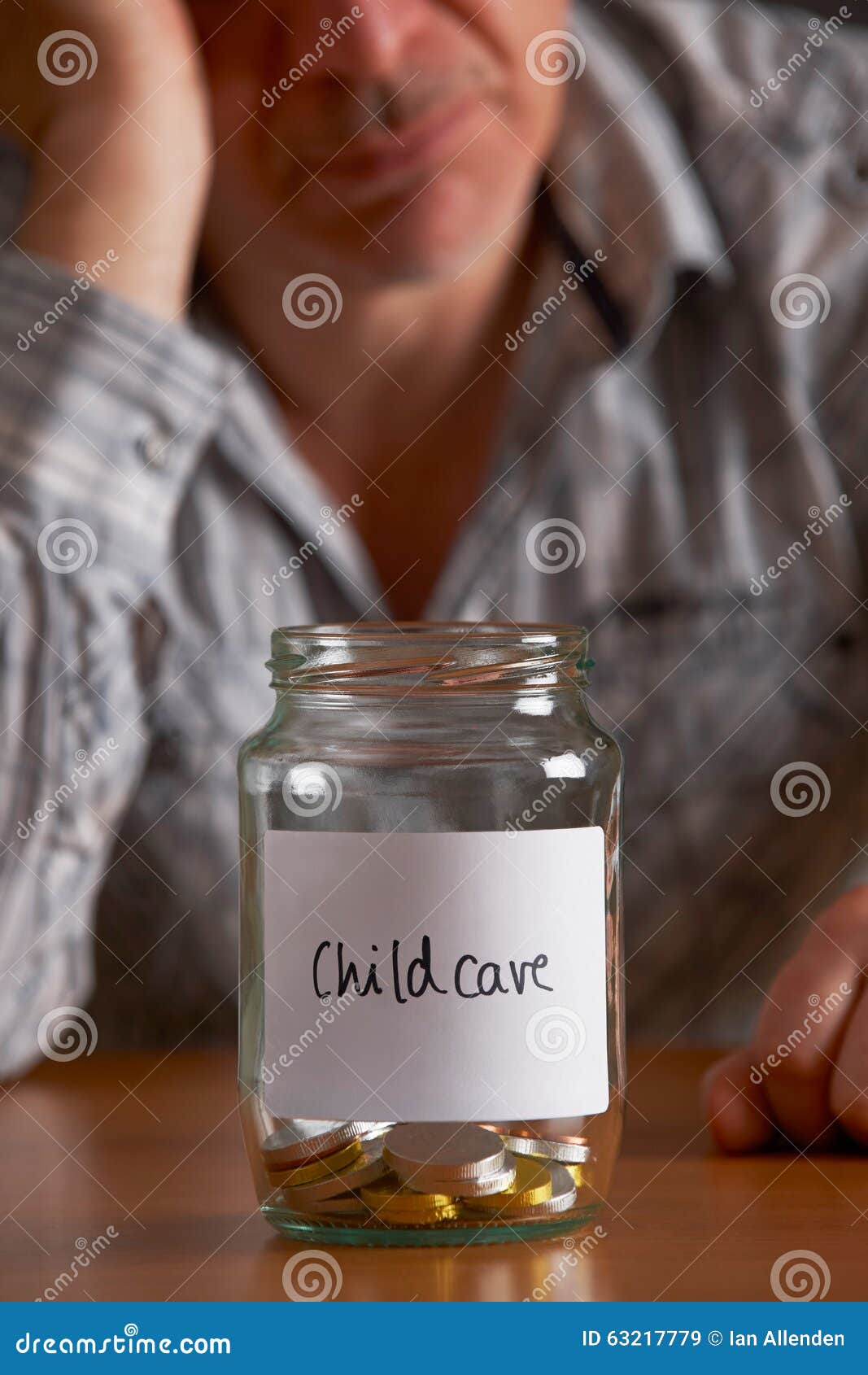 Depressed Man Looking at Empty Jar Labelled Childcare Stock Image ...