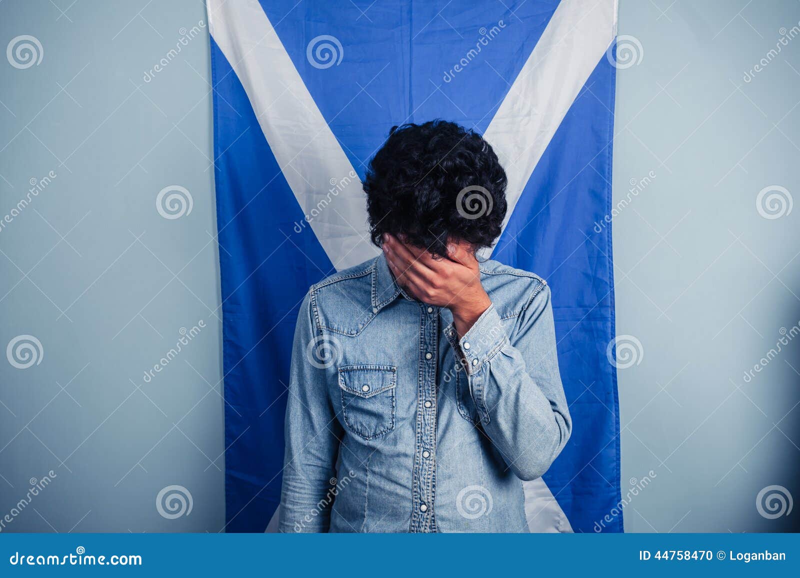 Depressed Man Standing in Front of Scottish Flag Stock Photo - Image of ...