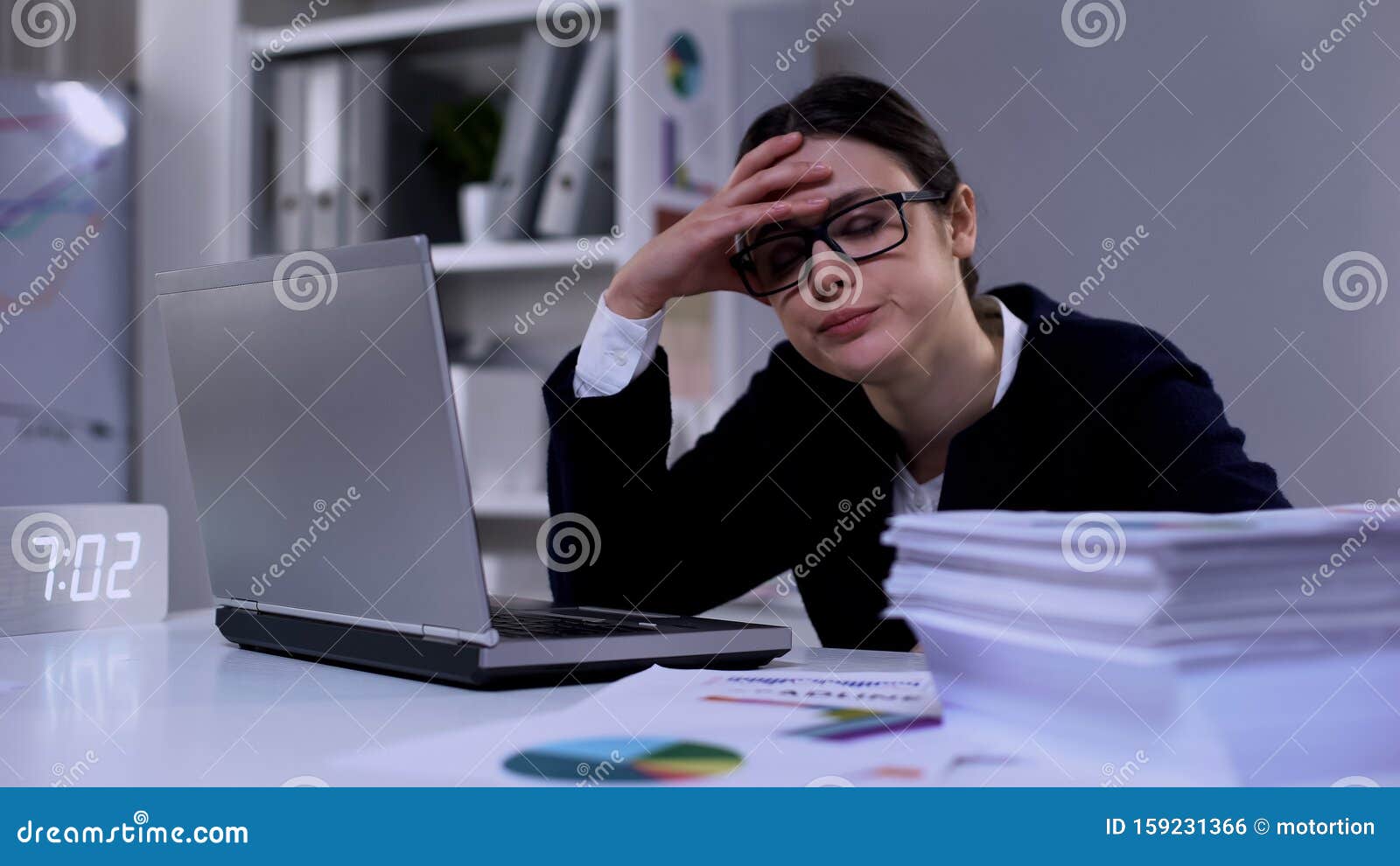 Depressed Office Worker Looking at Pile of Documents, Overwhelmed with ...