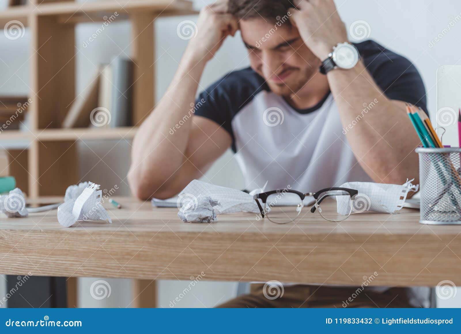 Depressed Student Studying at Table with Crumpled Papers Stock Photo ...