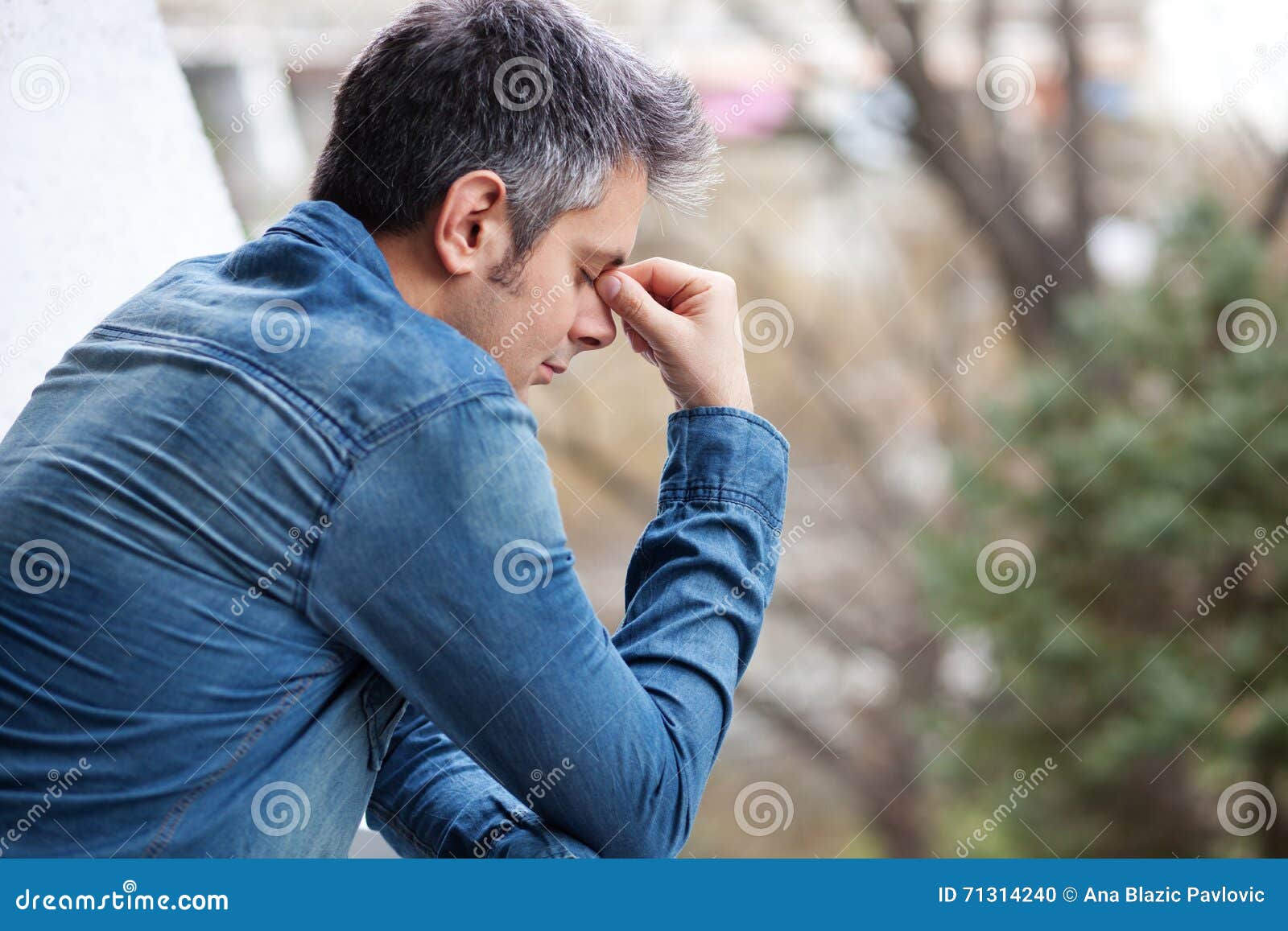 Depressed young man stock photo. Image of balcony, annoyed - 71314240