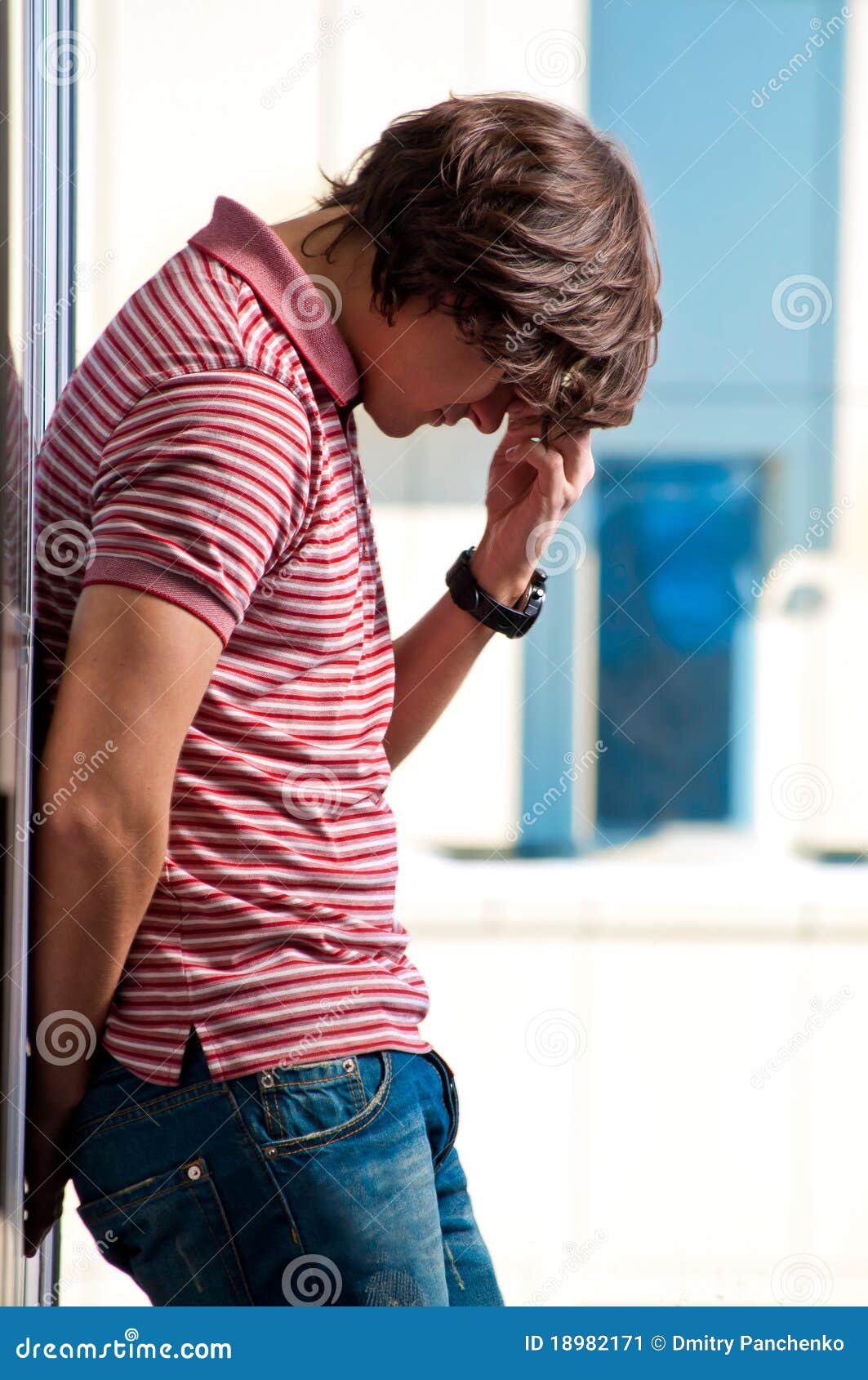 Depressed Young Man Standing Stock Image - Image of caucasian, hard ...