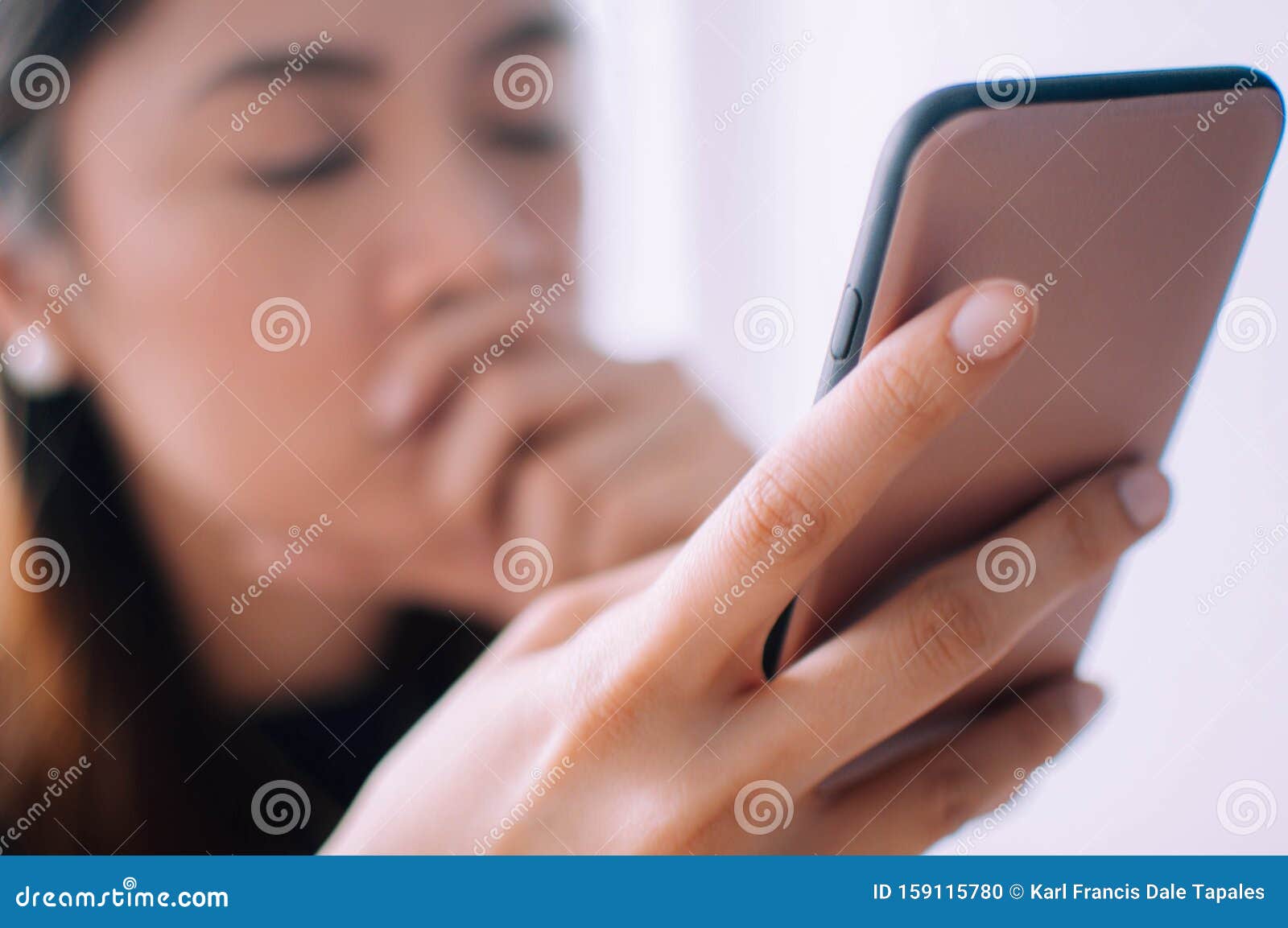 A Depressed Young Woman is Using a Mobile Phone Stock Photo - Image of ...